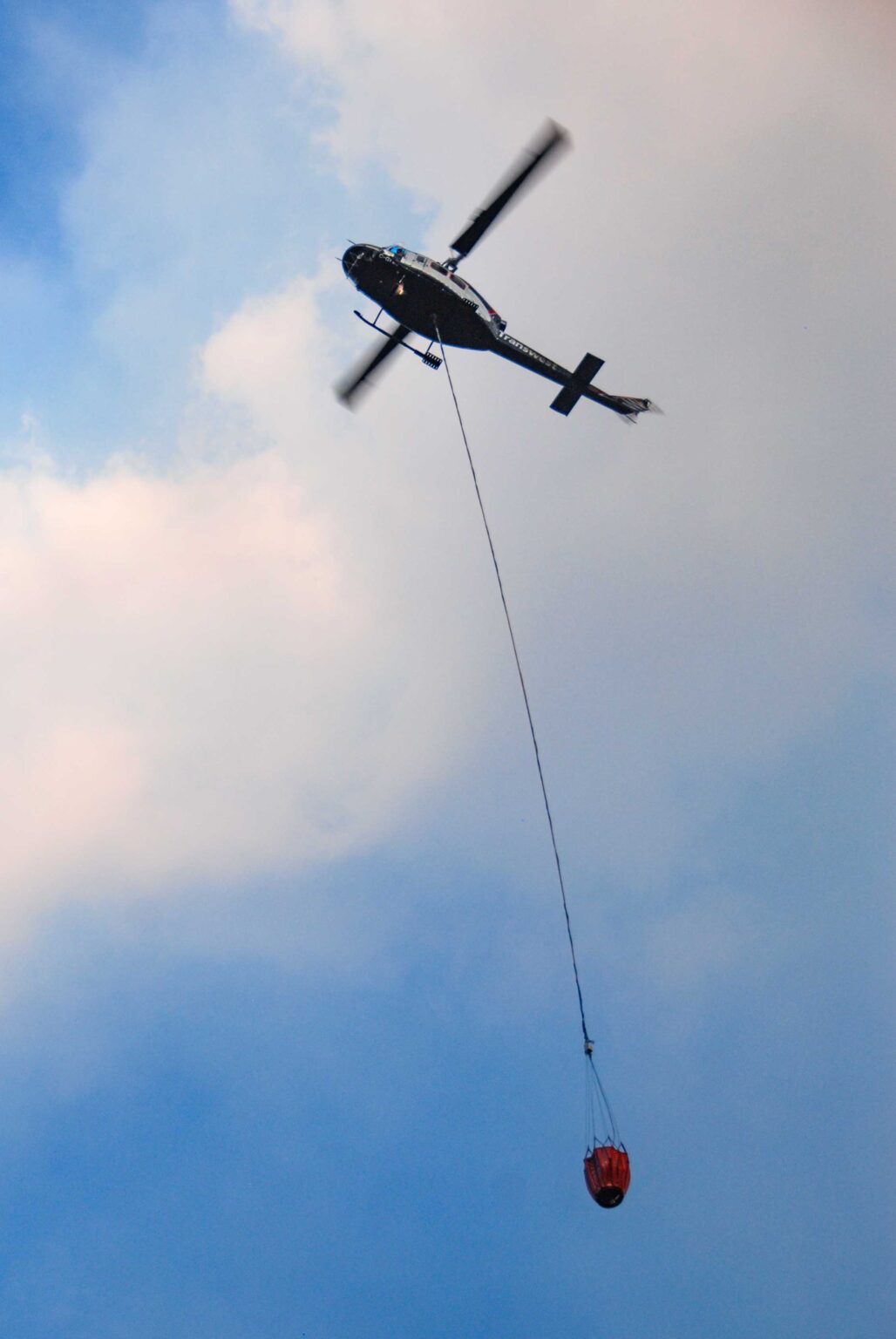 Firefighting helicopter crashes into sea trying to collect water as ...